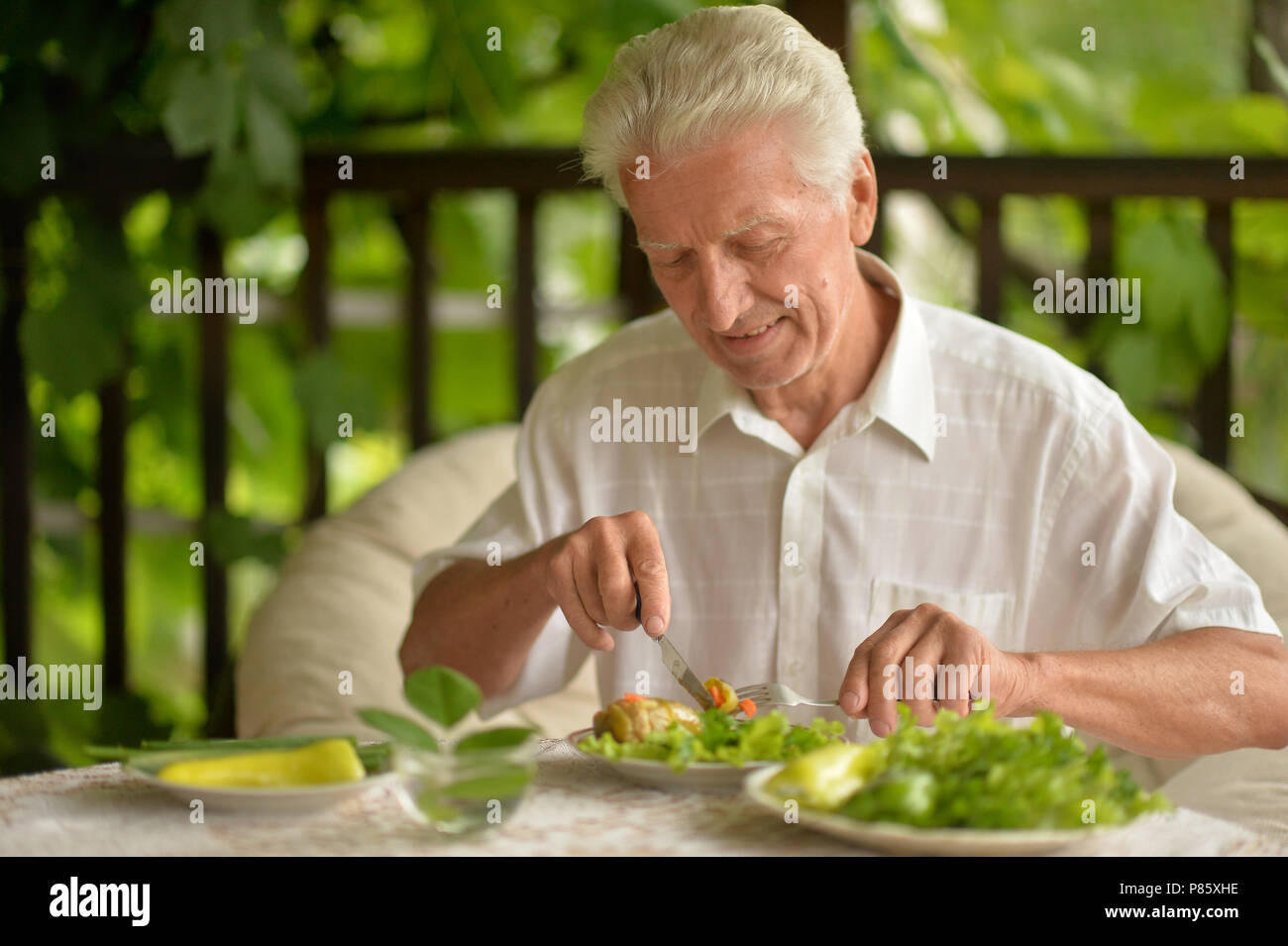 Senior caucasian man eating breakfast hi-res stock photography and ...