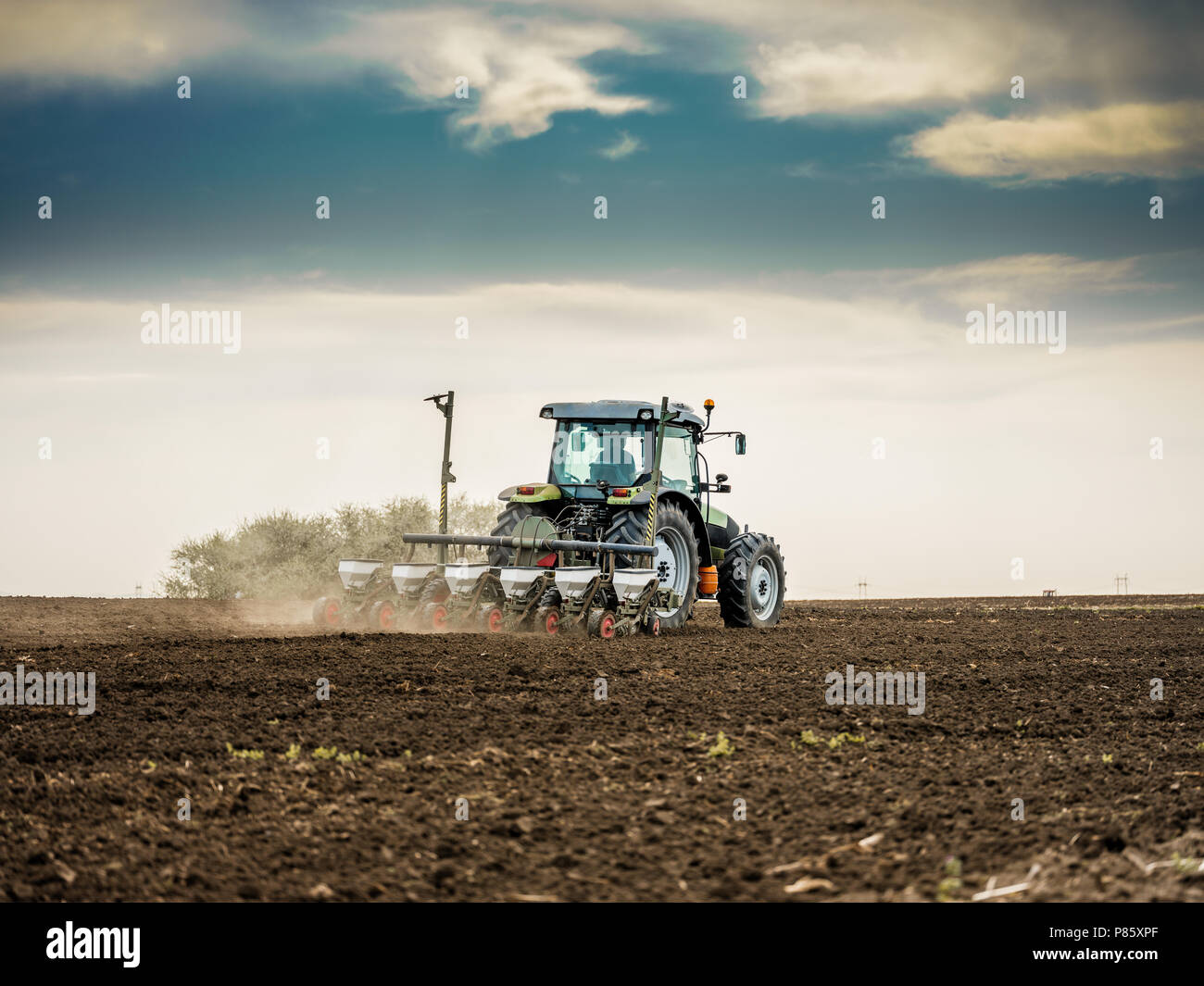 Farmer seeding, sowing crops at field. Sowing is the process of ...