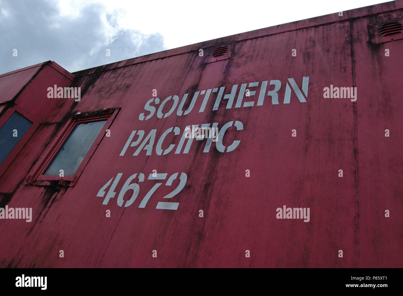 Red caboose train on railroad tracks Stock Photo - Alamy