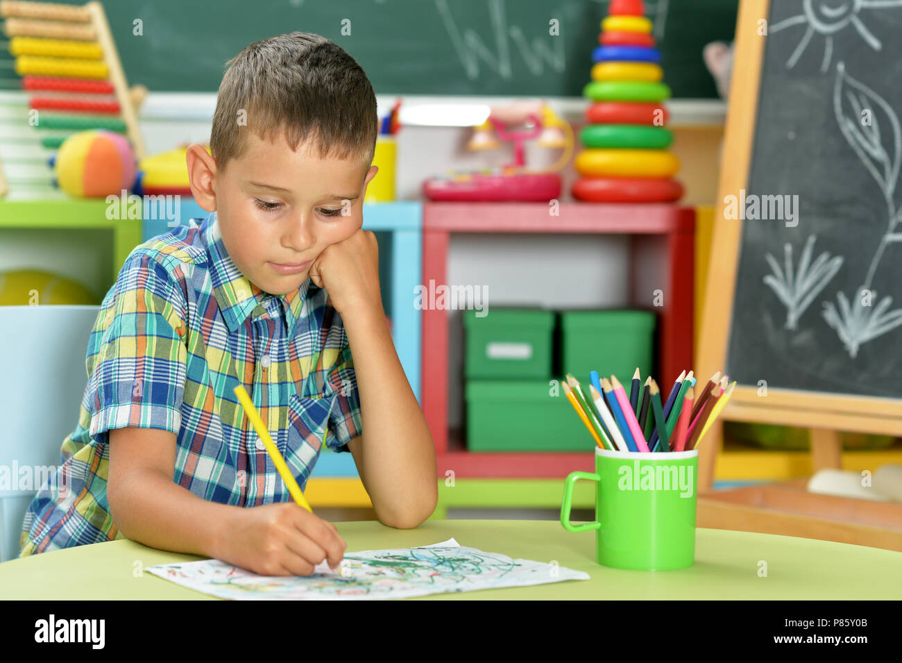 little boy drawing with pencil Stock Photo - Alamy