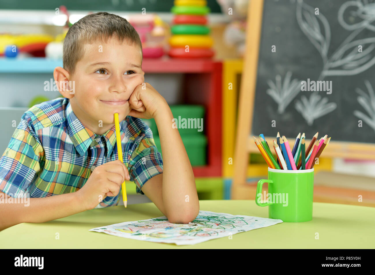 little boy drawing with pencil Stock Photo - Alamy