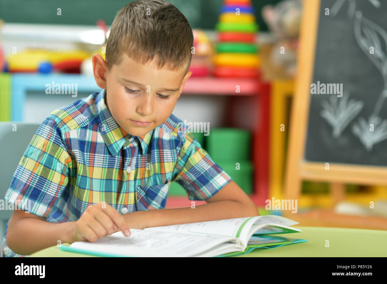 boy reading book Stock Photo - Alamy
