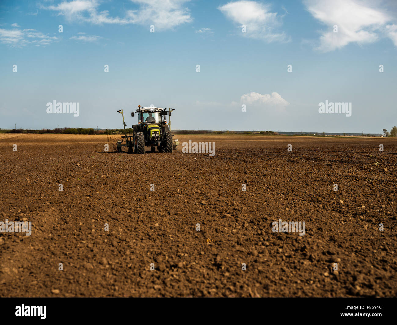 Farmer seeding, sowing crops at field. Sowing is the process of ...