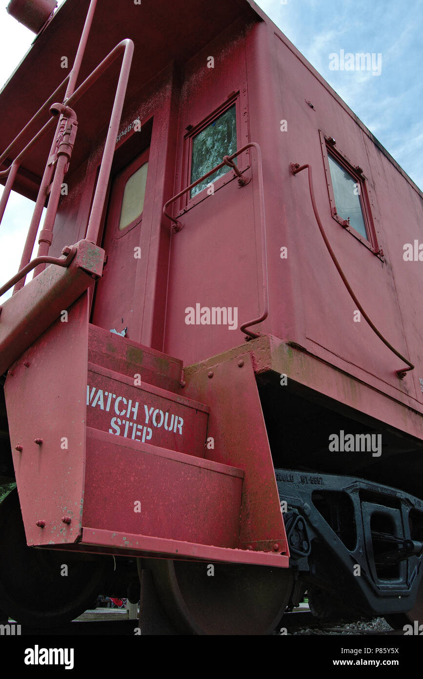 Red caboose train on railroad tracks Stock Photo - Alamy