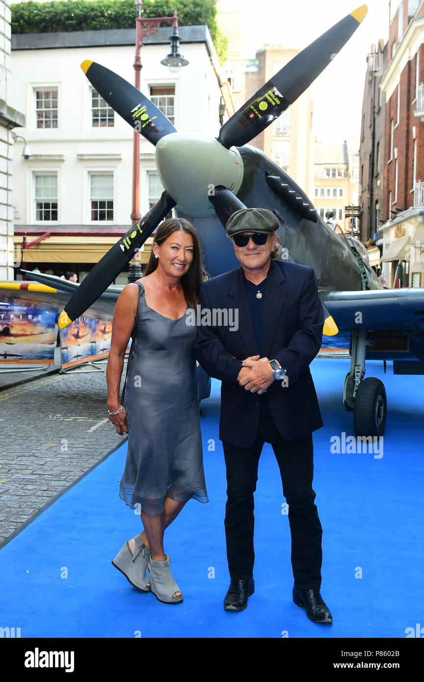 Brenda Johnson and Brian Johnson attending the premiere of Spitfire ...
