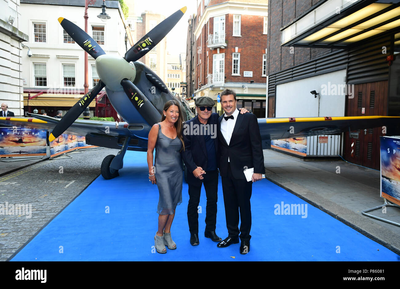 Brenda Johnson and Brian Johnson attending the premiere of Spitfire ...