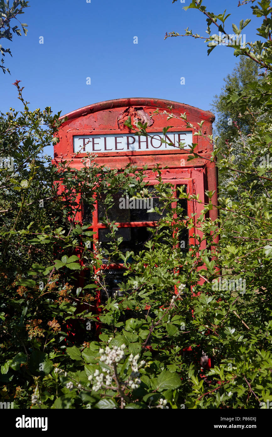 A view of a disused British red telephone box in a field Stock Photo ...