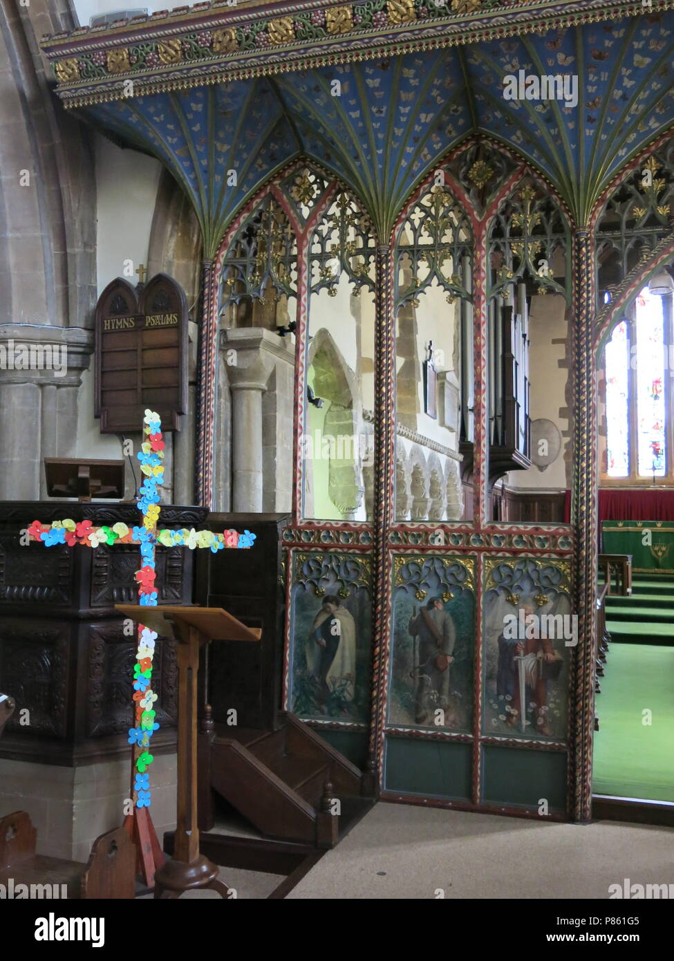 The 15th century rood screen, with butterfly decoration added in 1935 ...