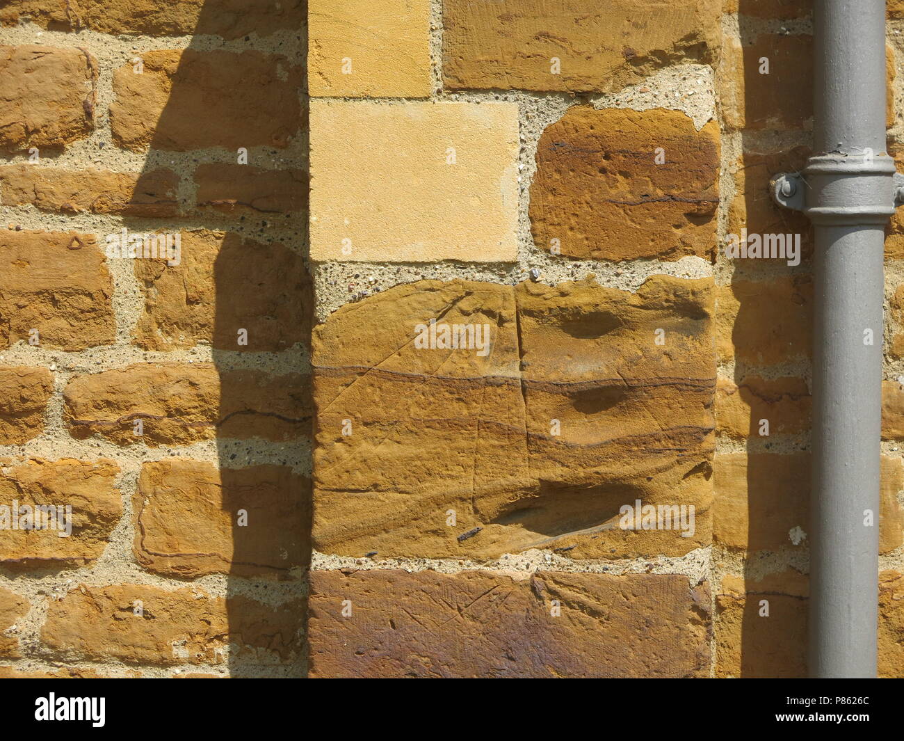A close-up of the dressed stone blockwork and scratch dials (used to ...
