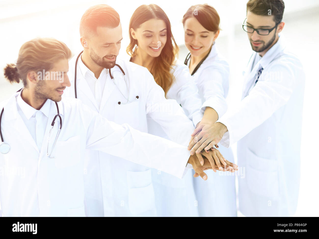 Joyful doctors are proud of their teamwork.concept of teamwork Stock ...