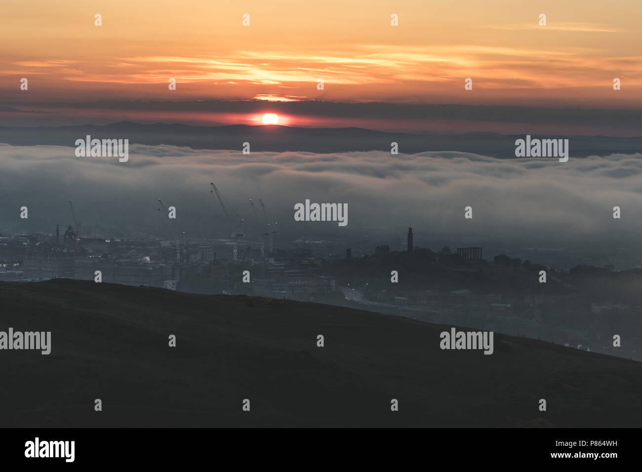 Sea mist (haar) engulfing Edinburgh, the capital of Scotland, shortly ...