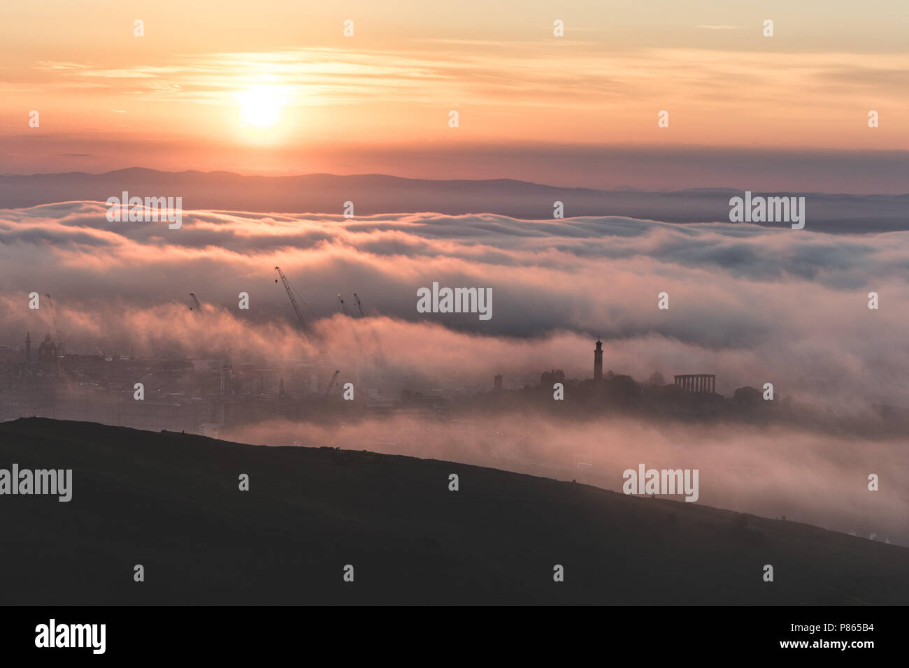 Sea mist (haar) engulfing Edinburgh, the capital of Scotland, shortly ...