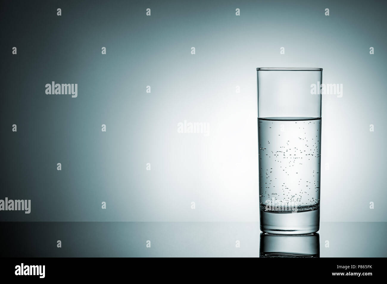 Glass of water with reflection Stock Photo - Alamy