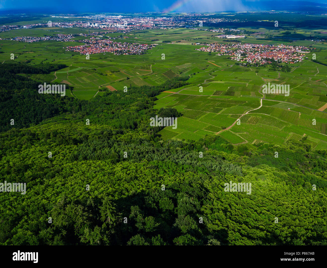 Aerial panoramic view of the rainbow over the green valley, Alsace ...