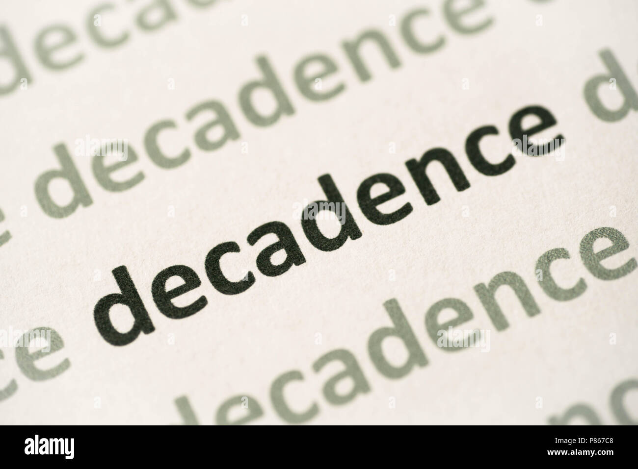 word decadence printed on white paper macro Stock Photo - Alamy