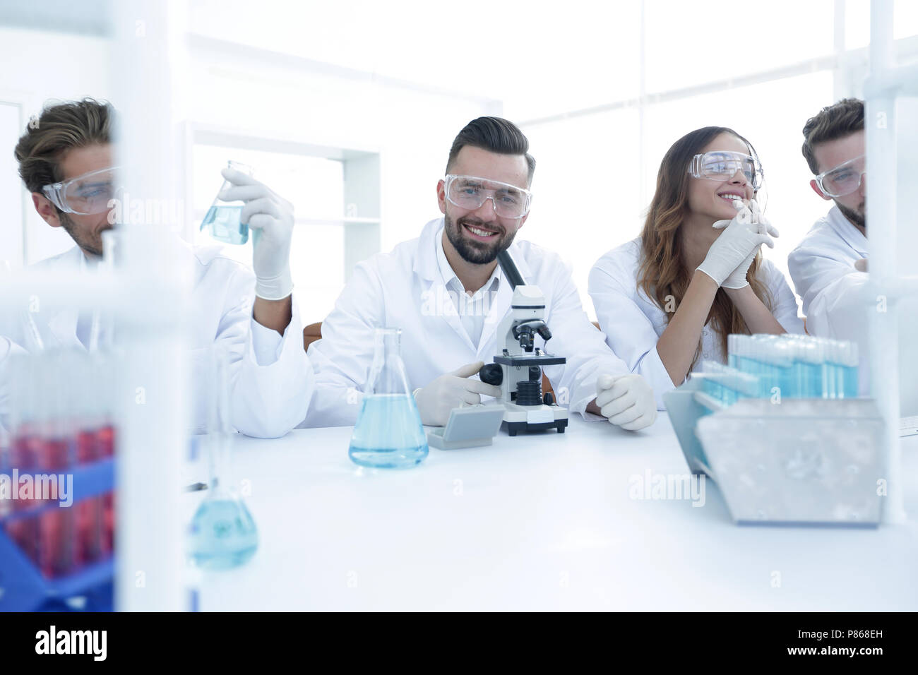 background image is a group of scientists microbiologists Stock Photo ...