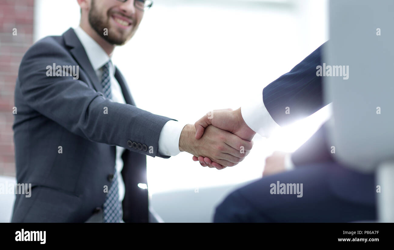 Close up of business handshake in the office Stock Photo - Alamy