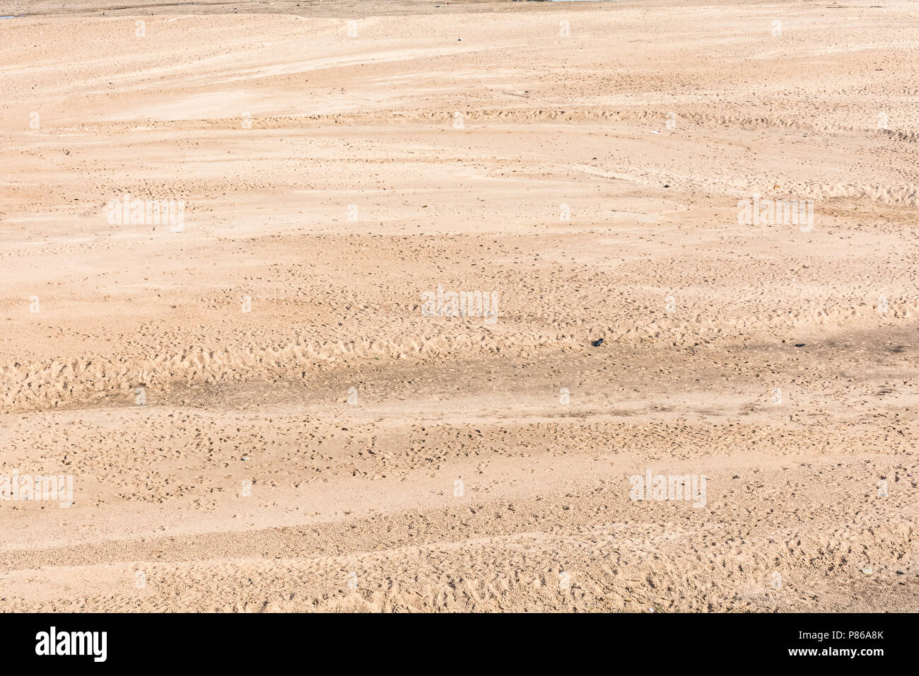 Indian river sandy bed with with power grid cable laying background ...