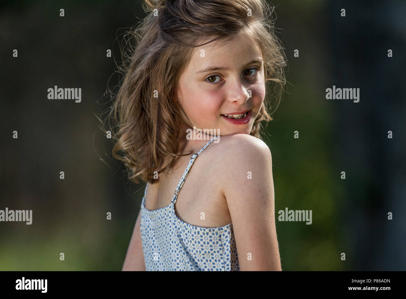 Girl looking back at camera hi-res stock photography and images - Alamy