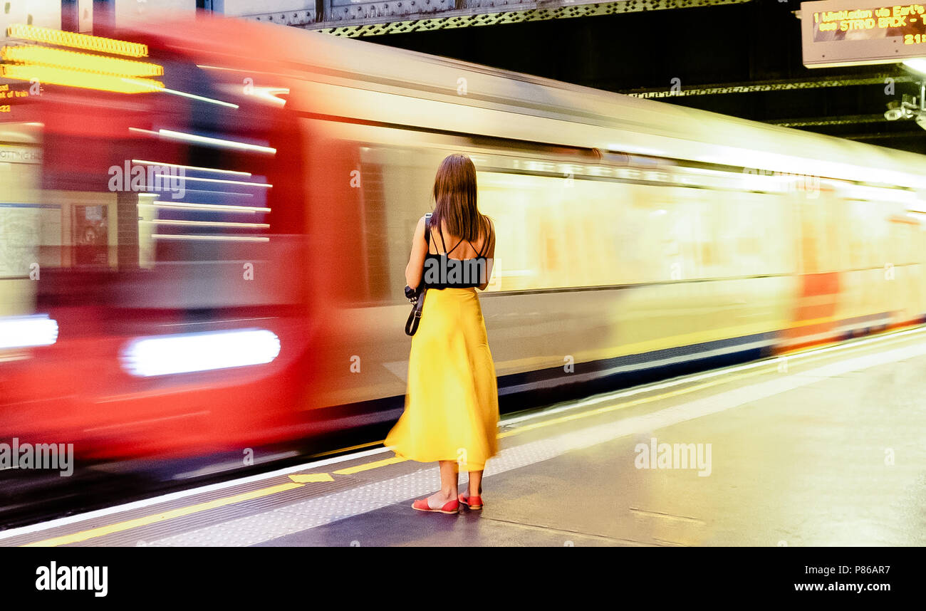 London Underground tube network, passenger getting on train on Notting ...