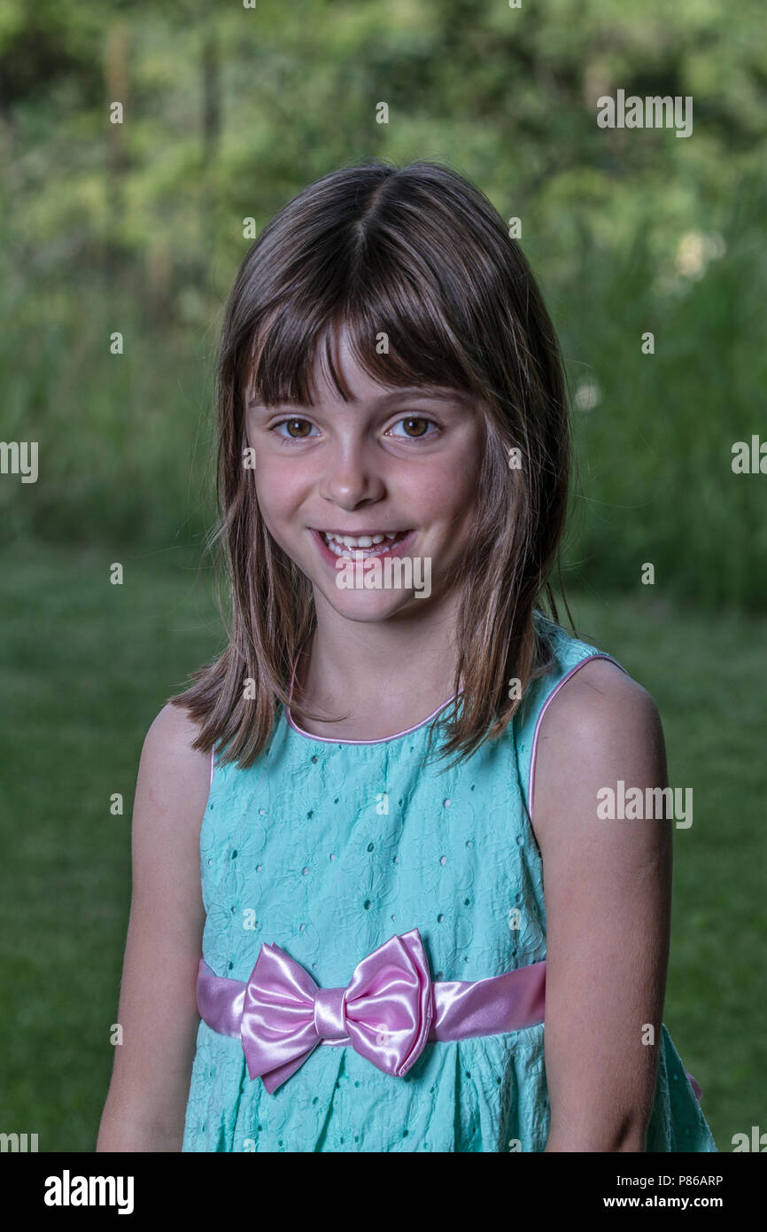 Dark haired, pretty pre-teen caucasian girl, posing for camera. Charlie ...
