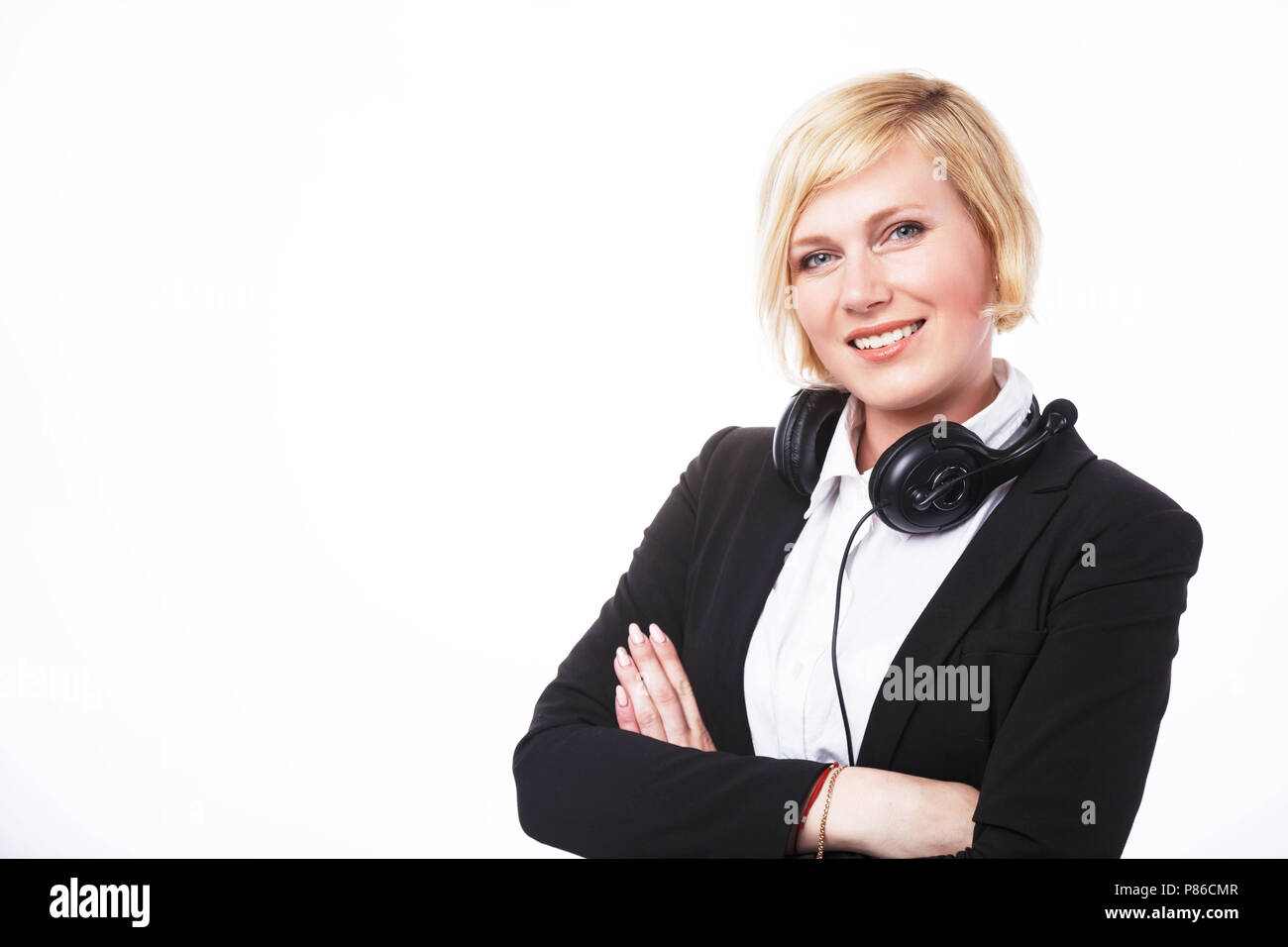 Smiling call center operator, blonde woman dressed in black jacket ...