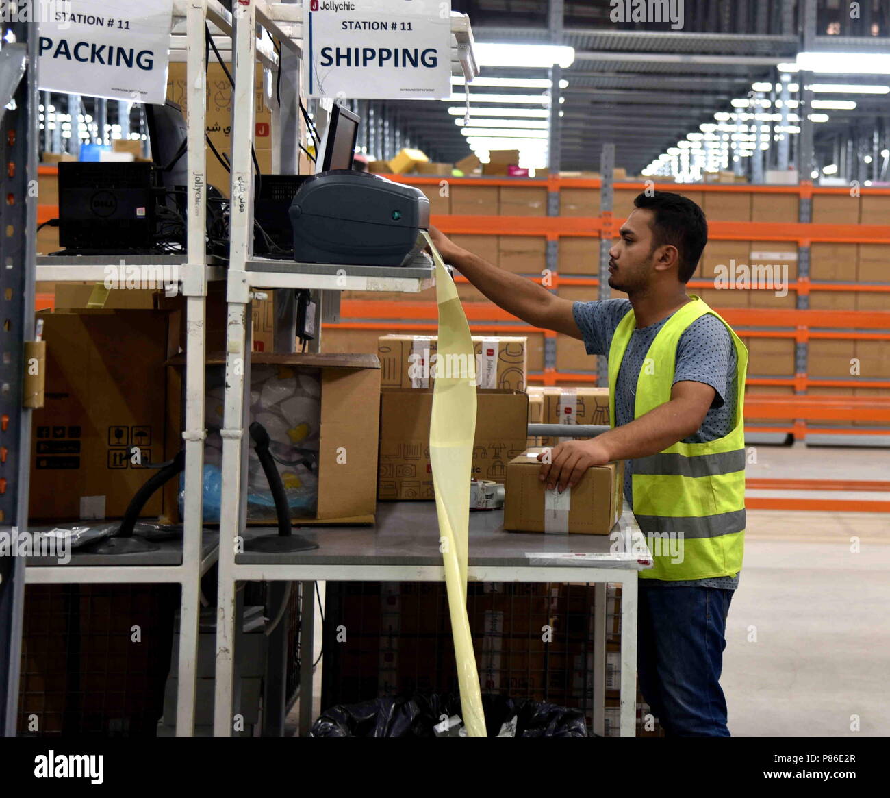 Riyadh. 9th July, 2018. A staff works in a storehouse of JollyChic in ...