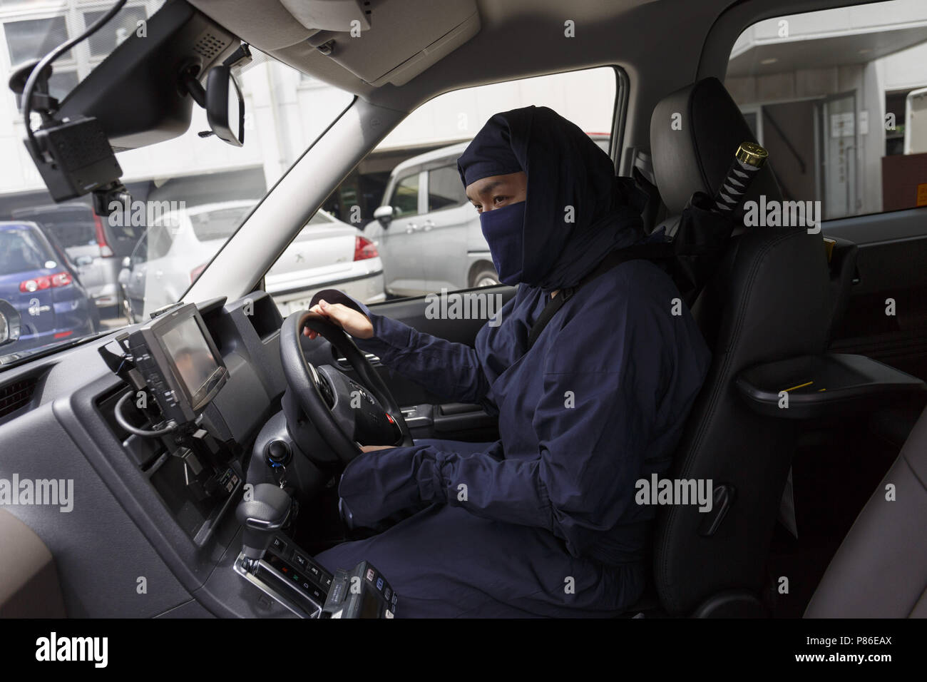 July 9, 2018 - Yokohama, Japan - A Sanwa Koutsu Group taxi driver ...