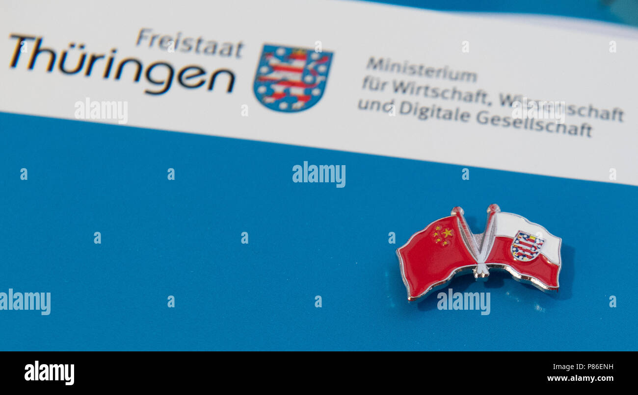 09 July 2018, Germany, Berlin: A badge with the flags of Thuringia and ...