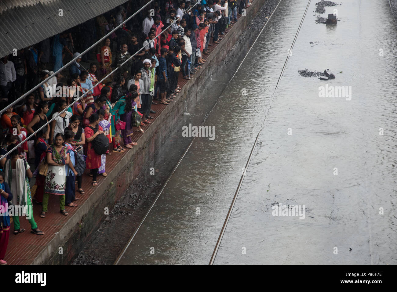 Mumbai rain station hi-res stock photography and images - Alamy