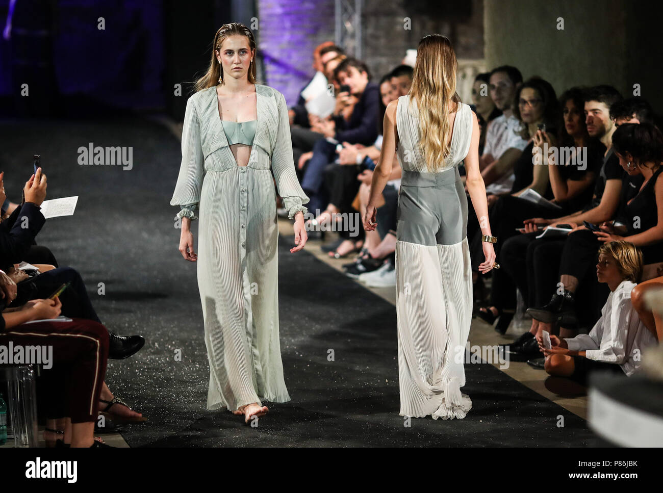 Rome, Italy. 9th July, 2018. Models present creations during the ...