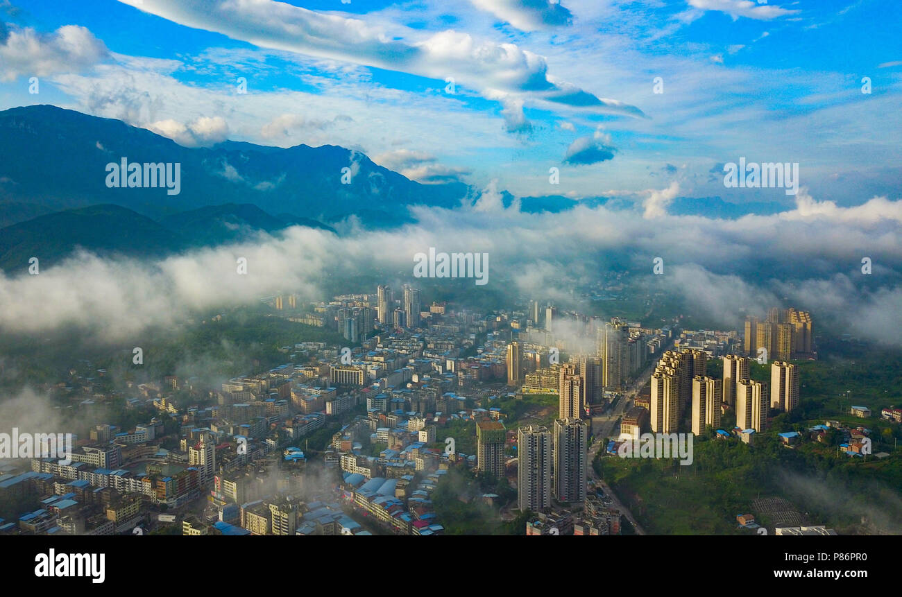 Huaying, Huaying, China. 10th July, 2018. Huaying, CHINA-Mist envelops ...