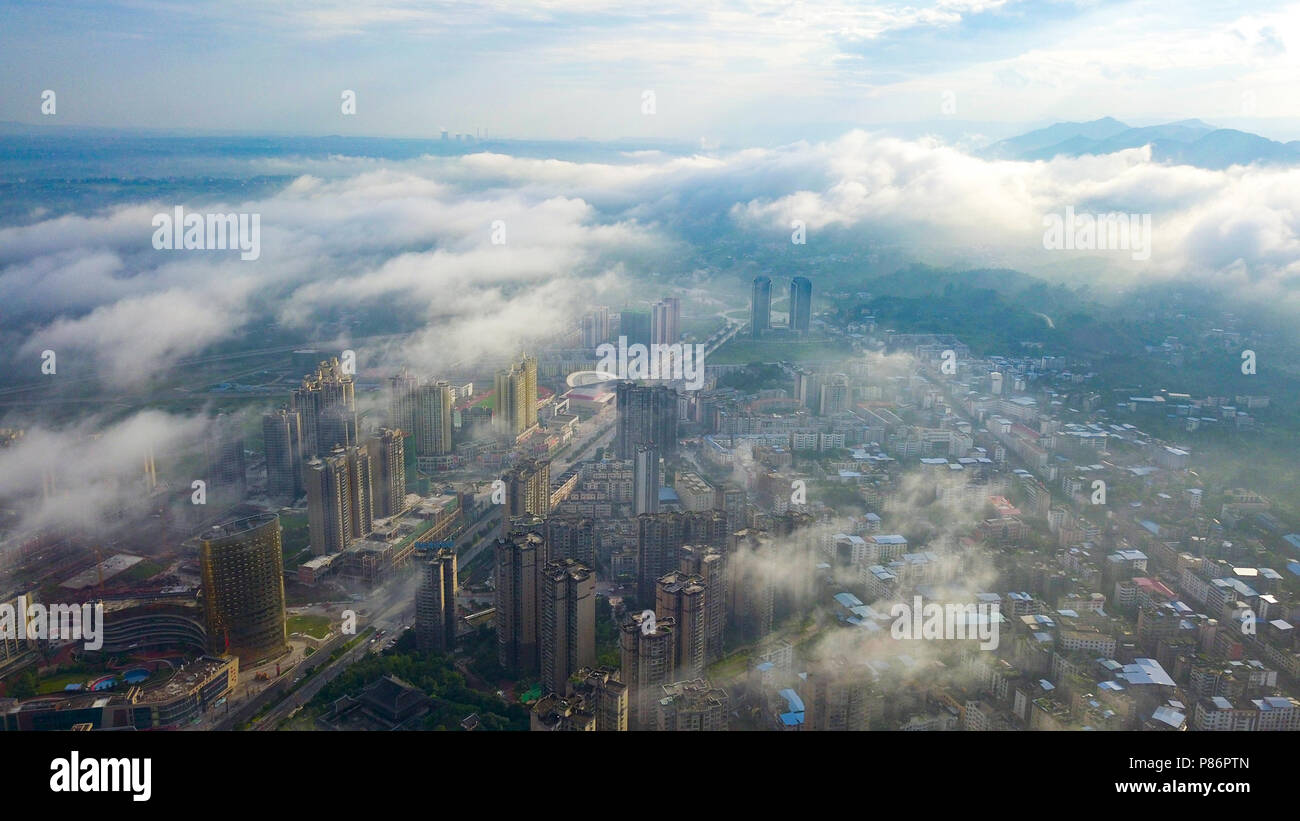 Huaying, Huaying, China. 10th July, 2018. Huaying, CHINA-Mist envelops ...