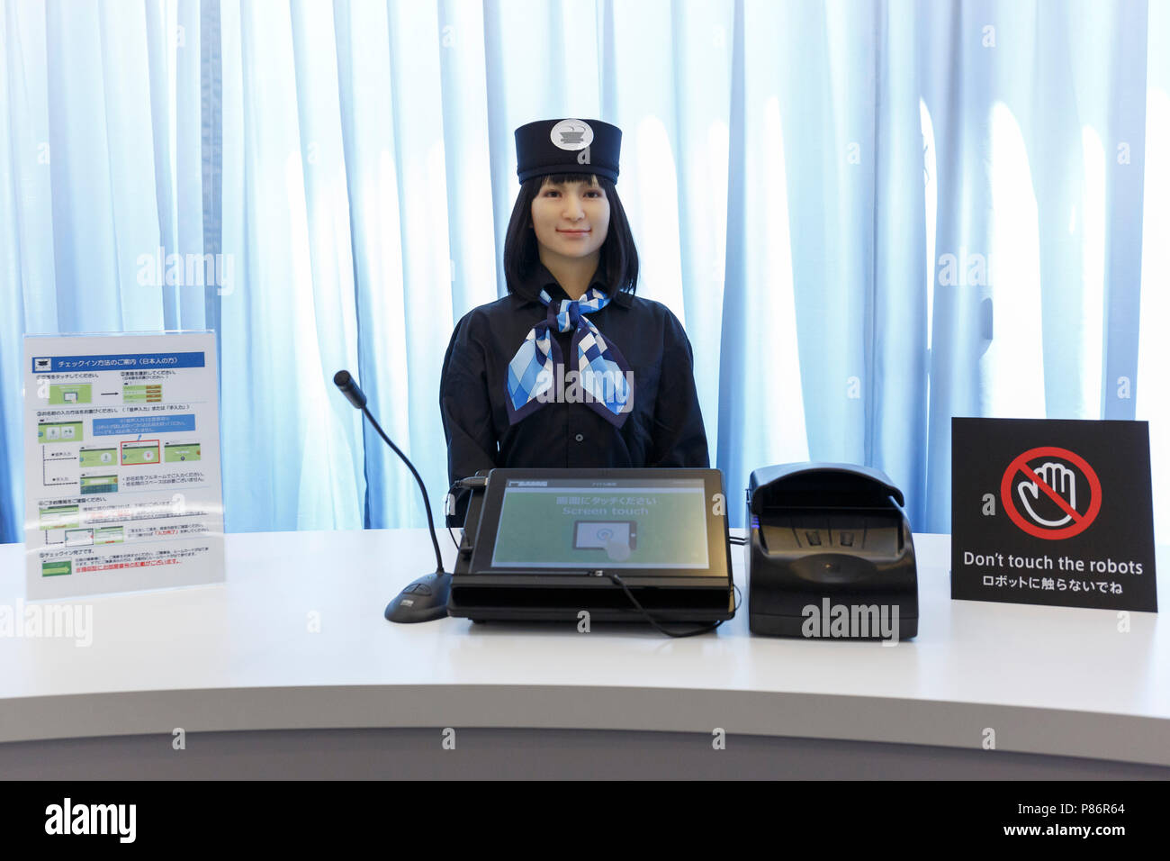 Tokyo, Japan. 10th July 2018. A humanoid robot works at the front desk ...