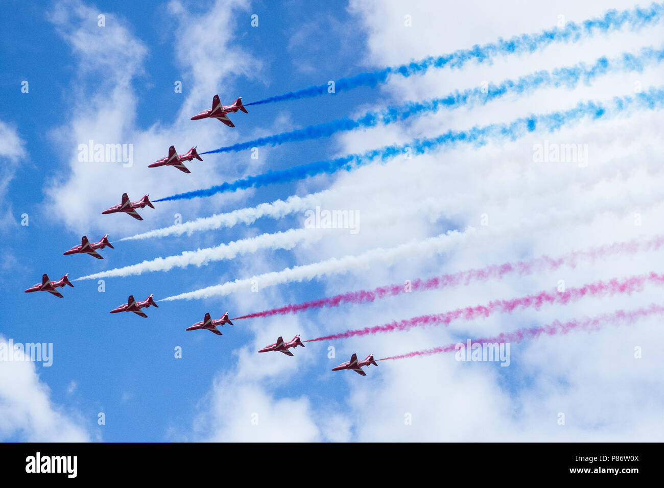 Windsor, UK. 10th July, 2018. The Red Arrows fly over Windsor as part ...
