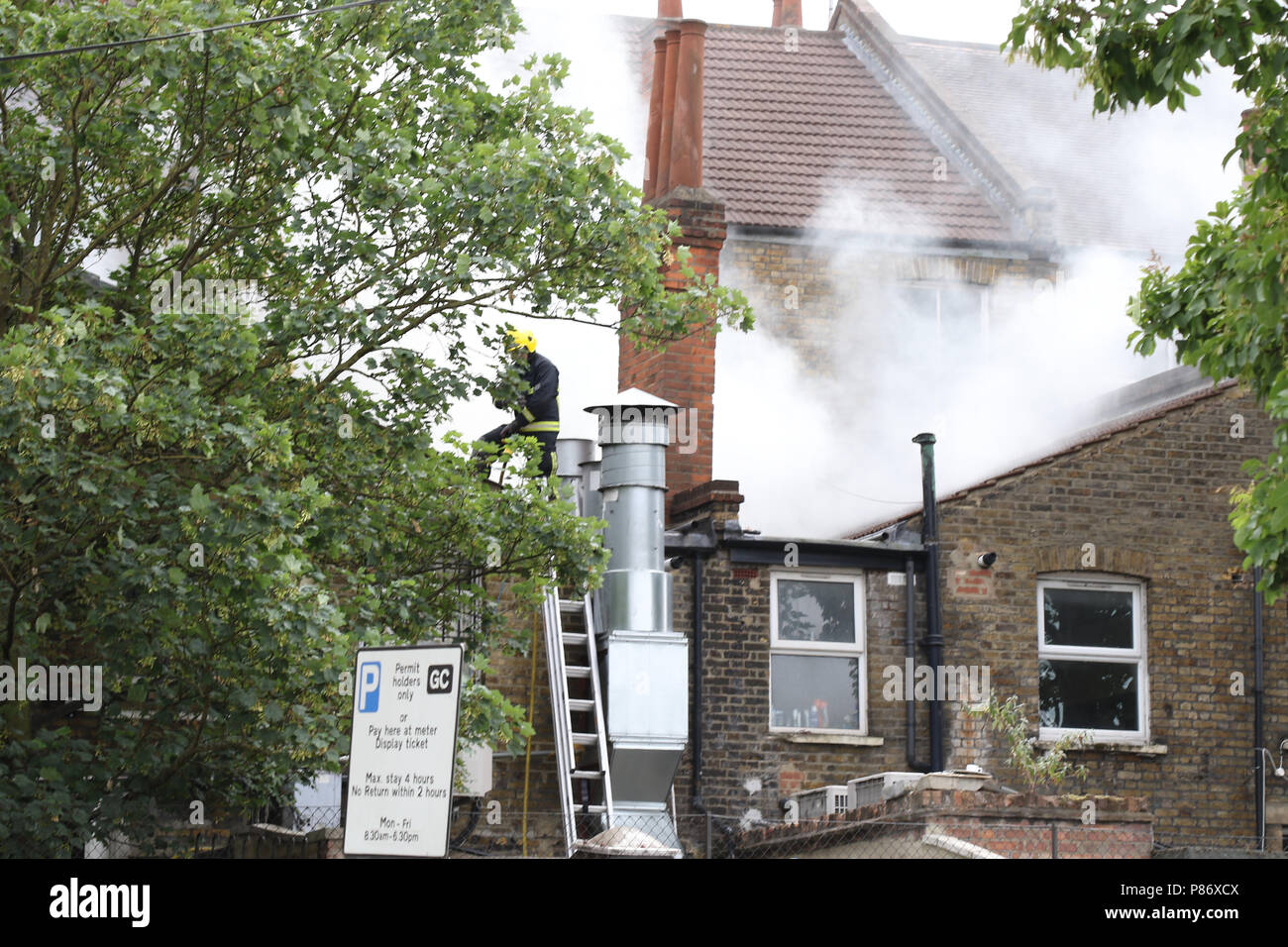 London, UK. 10th July 2018. Firefighters battling a fire on Willesden ...