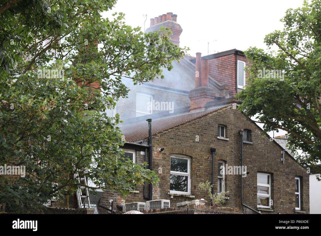 London, UK. 10th July 2018. Firefighters battling a fire on Willesden ...