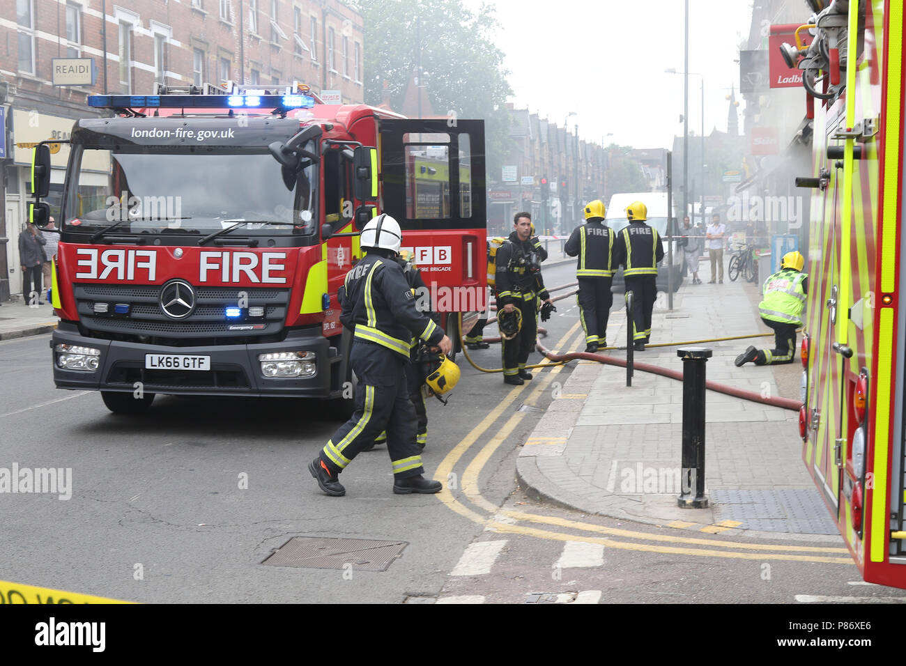 London, UK. 10th July 2018. Firefighters battling a fire on Willesden ...