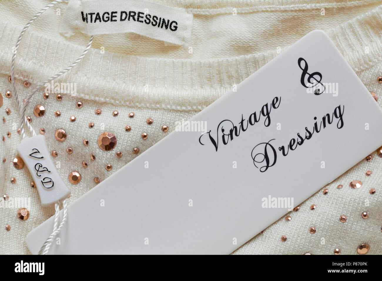 Vintage Dressing label on woman's jumper Stock Photo - Alamy