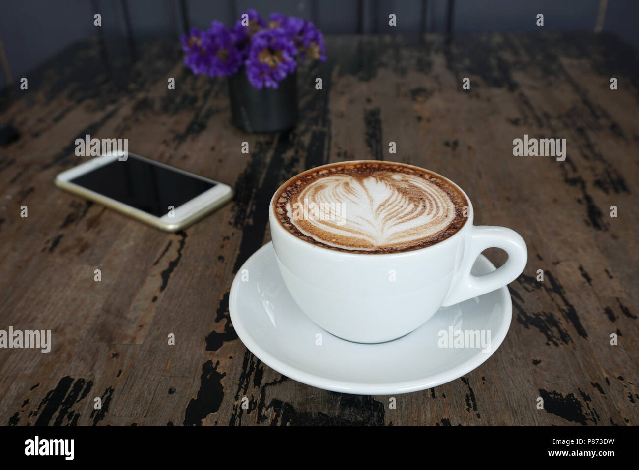 A cup of mocha coffee on wood table Stock Photo - Alamy