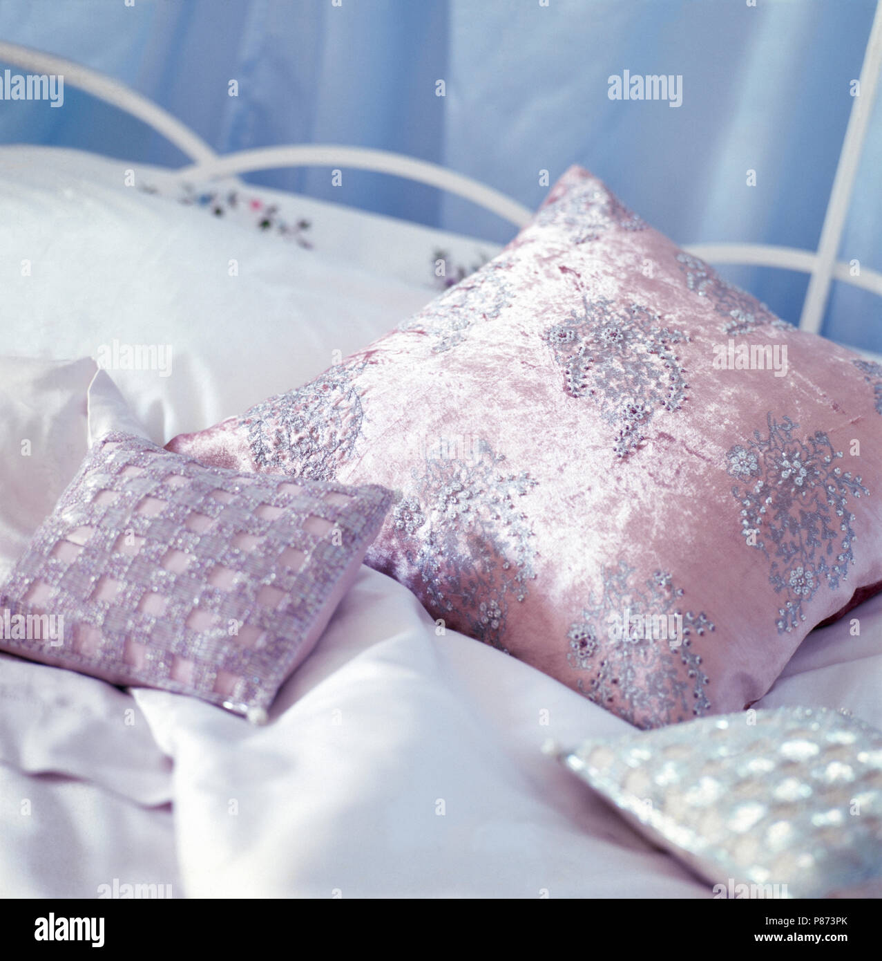 Close-up of pink and mauve silk velvet cushions with decorative ...