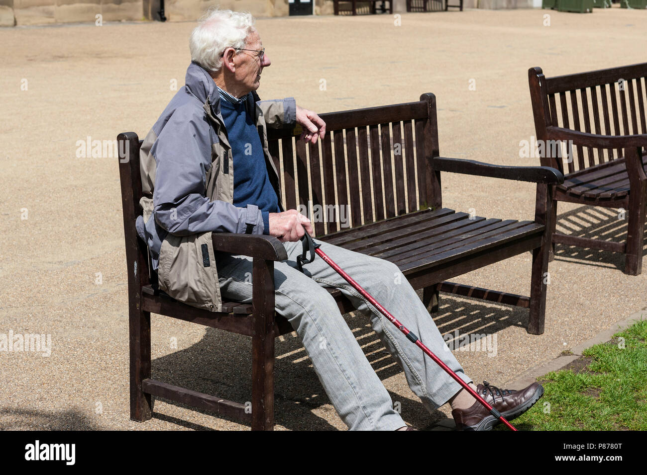 Old man sits on a park bench in the Pavilion Gardens, Buxton ...