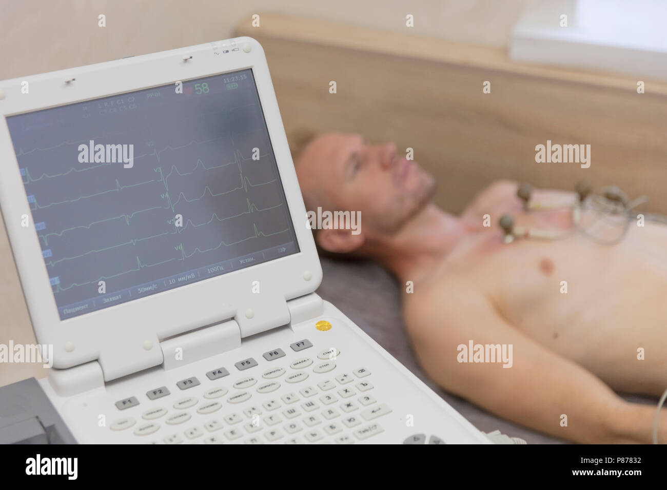 life monitoring doctor with electrocardiogram equipment making ...