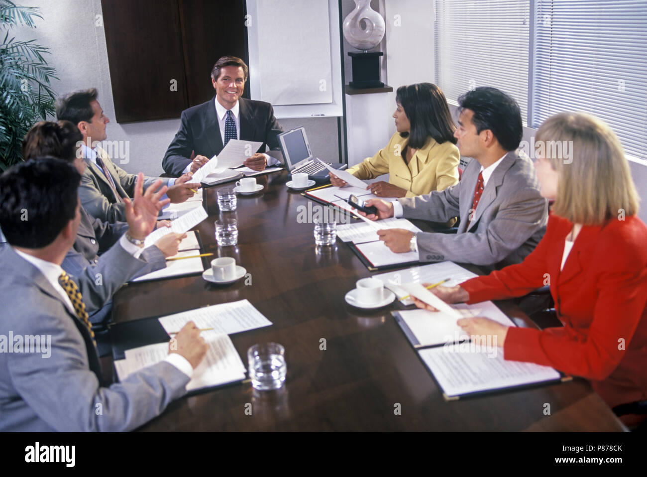 1997 HISTORICAL GROUP OF MULTI ETHNIC BUSINESS PEOPLE MEETING IN OFFICE ...