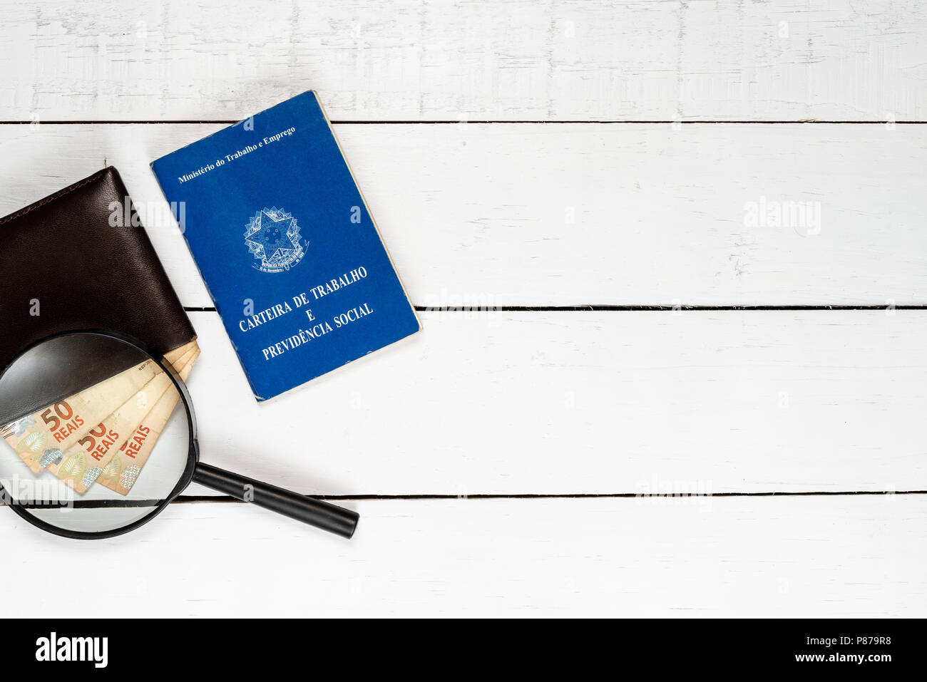 Wallet with Brazilian money notes, glasses and work permit on white ...