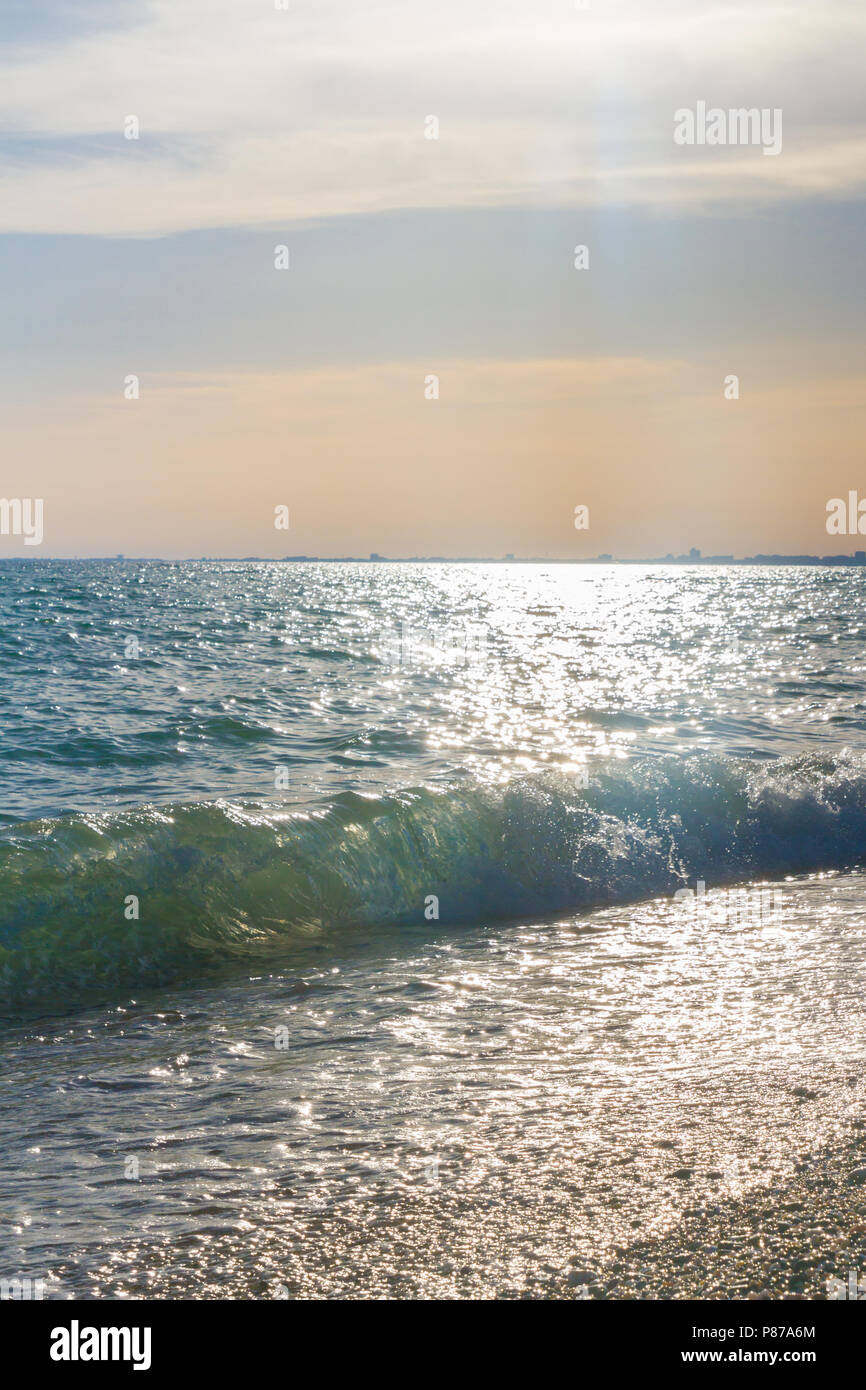 Beach on a Sunny summer day during sunset Stock Photo - Alamy