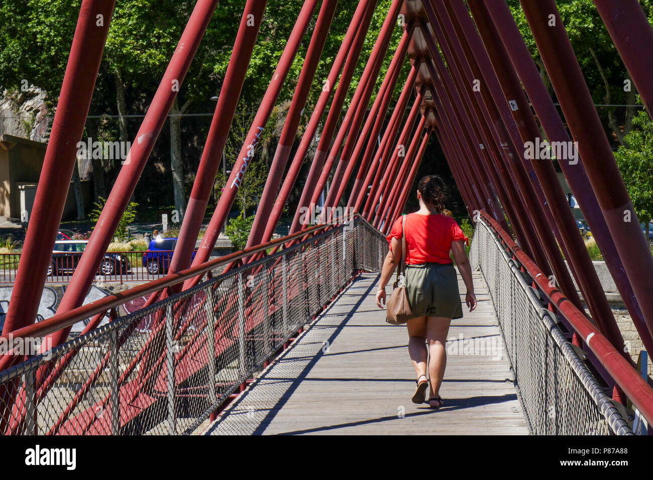 Pedestrian bridge of "L'homme de la Roche" crosses the River Saone ...