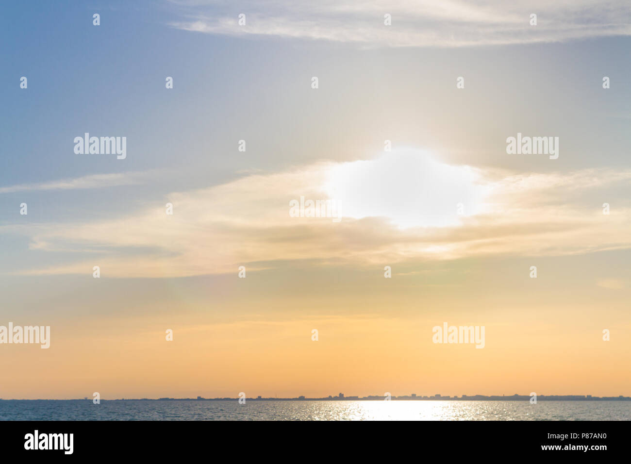 Beautiful summer sunset with clouds over the sea Stock Photo - Alamy