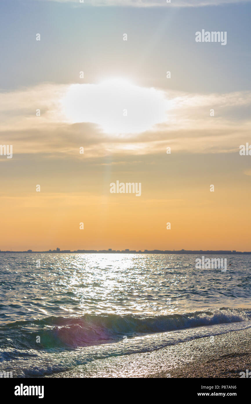 Beautiful summer sunset with clouds over the sea Stock Photo - Alamy