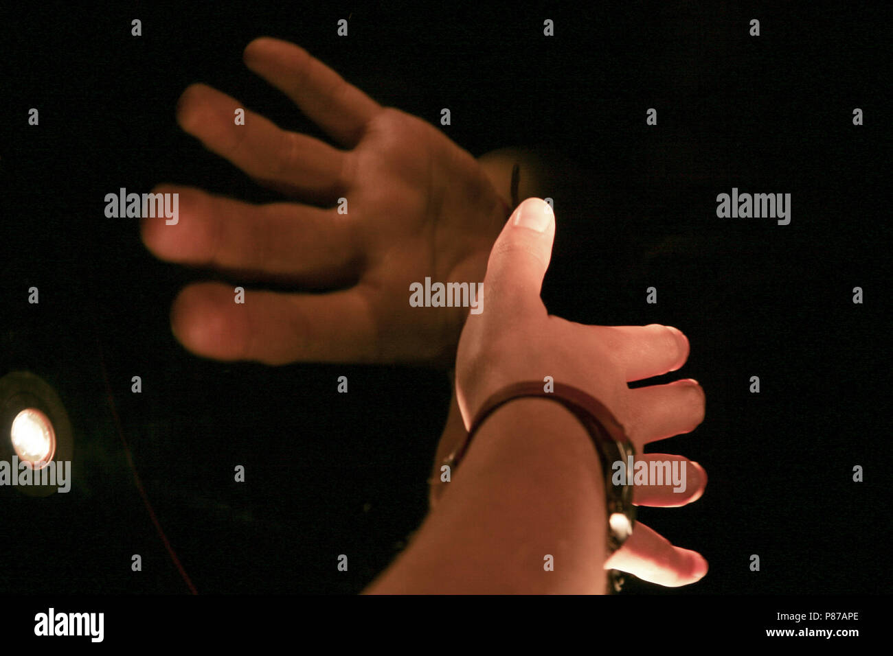 human hand grabbing another, appears magical, illusion like Stock Photo ...